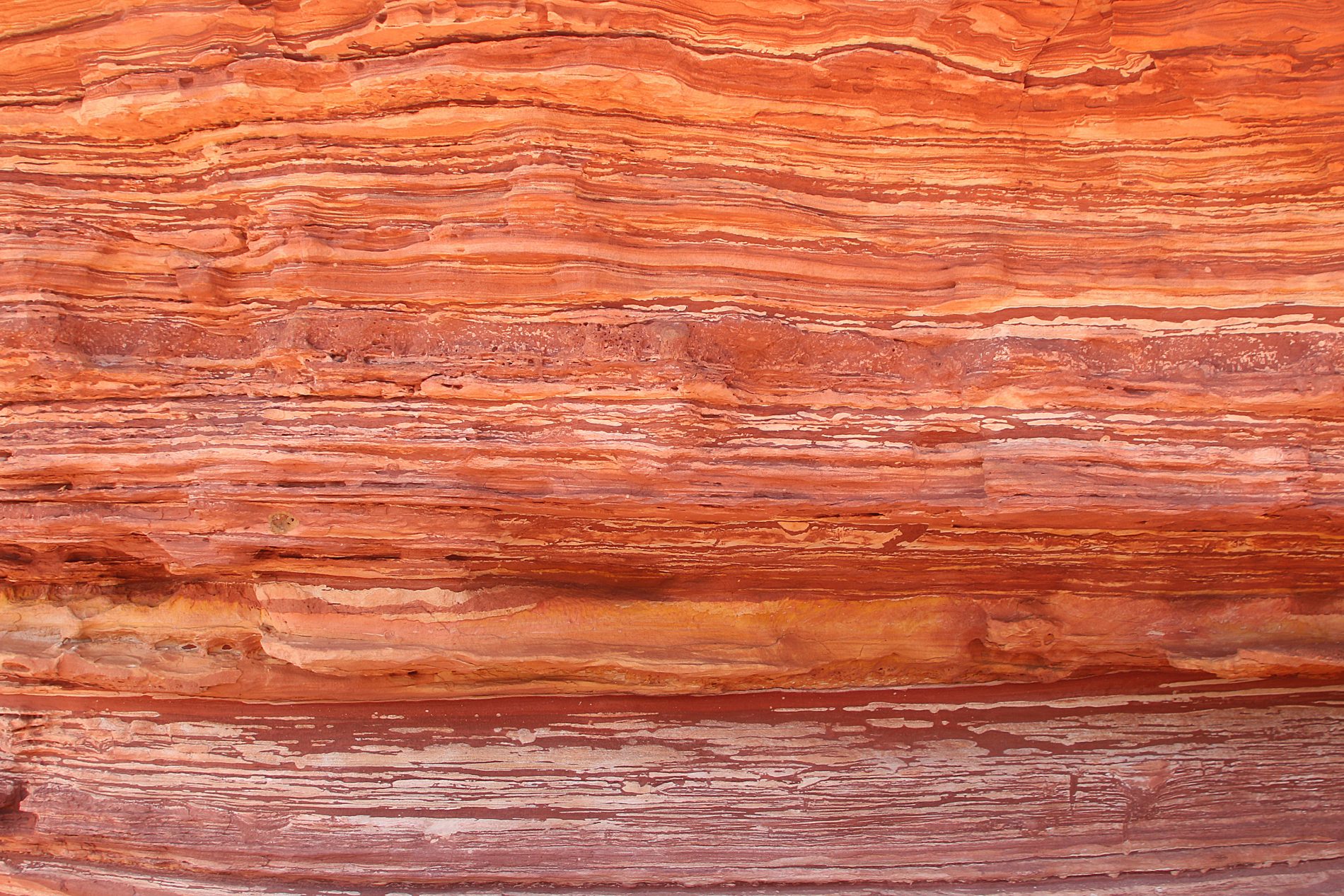 Orange and yellow layered rock face in Kalbarri National Park, Western ...